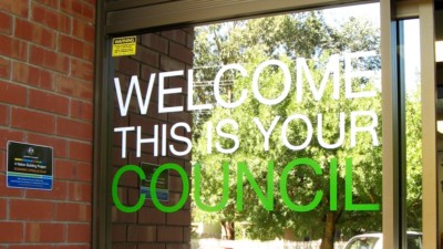 Self adhesive lettering on the outside of tinted windows, Woodside Library